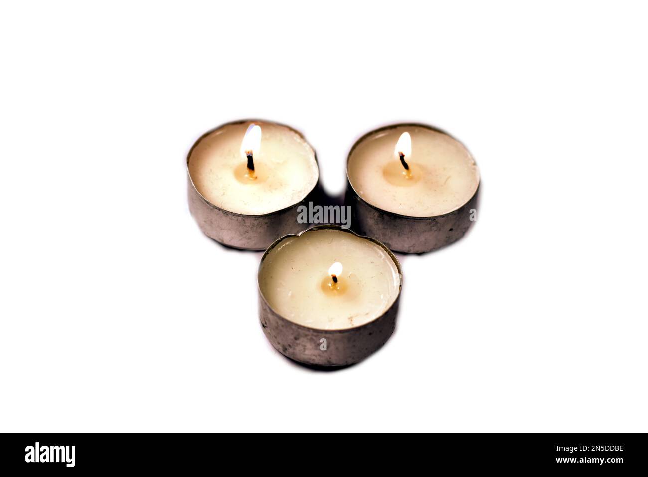 Three candles on a white background Stock Photo - Alamy