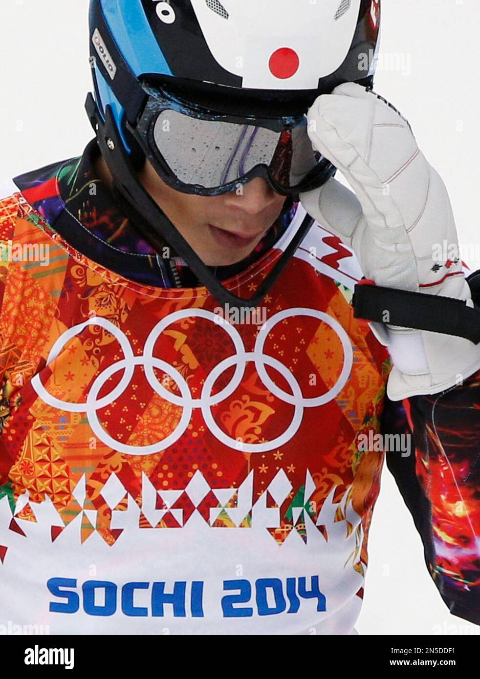 Japan's Naoki Yuasa reacts after finishing the first run of the men's slalom at the Sochi 2014 ...