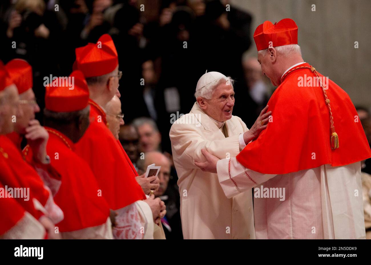 Newly-elected Cardinal Gerhard Ludwig Mueller, right, is greeted by ...