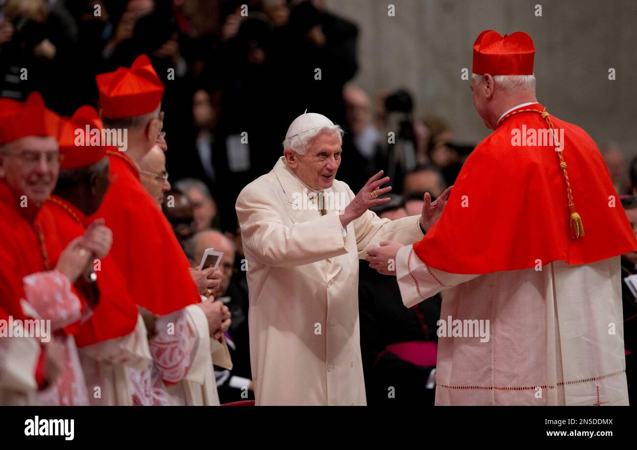 Newly-elected Cardinal Gerhard Ludwig Mueller, right, is greeted by Pope Emeritus Benedict XVI ...