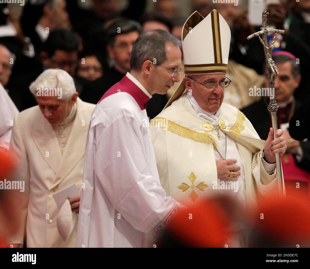 Pope Francis holds his pastoral staff after greeting Pope Emeritus ...