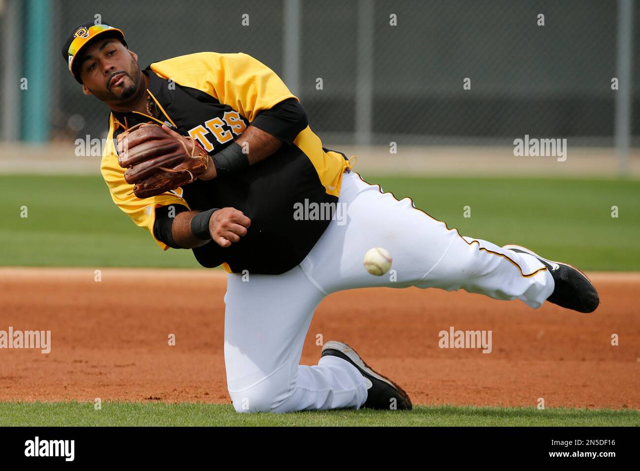 Pittsburgh Pirates' Pedro Alvarez throws from his knee while fielding ...