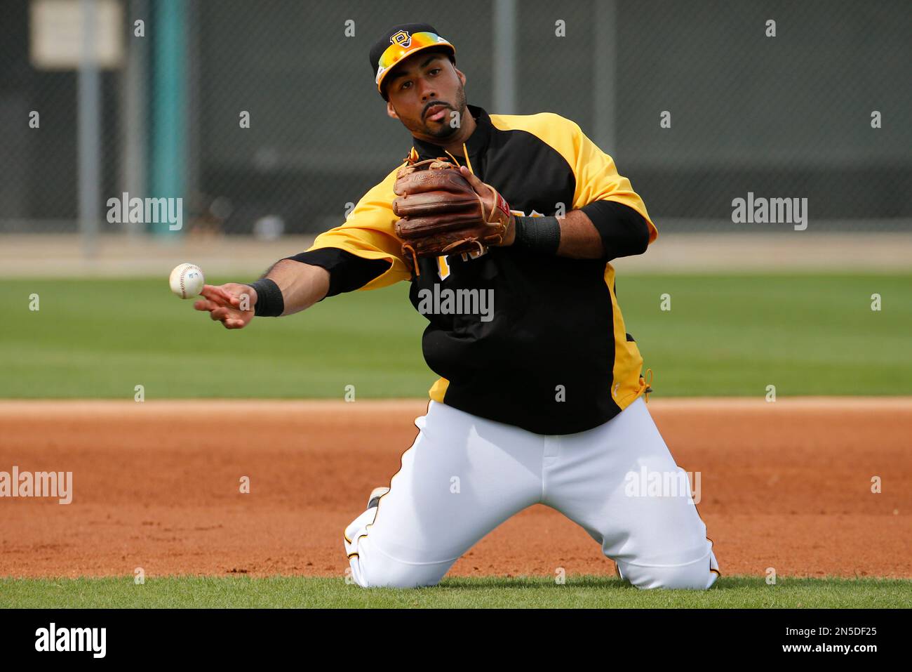 Pittsburgh Pirates' Pedro Alvarez throws from his knee while fielding ...