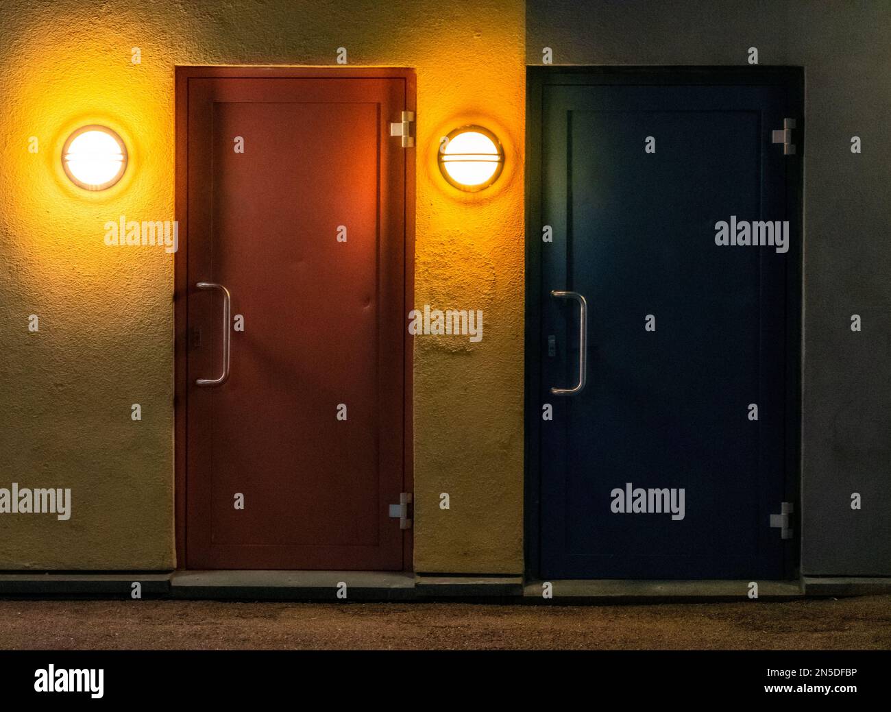 The different colored doors with wall lights Stock Photo - Alamy