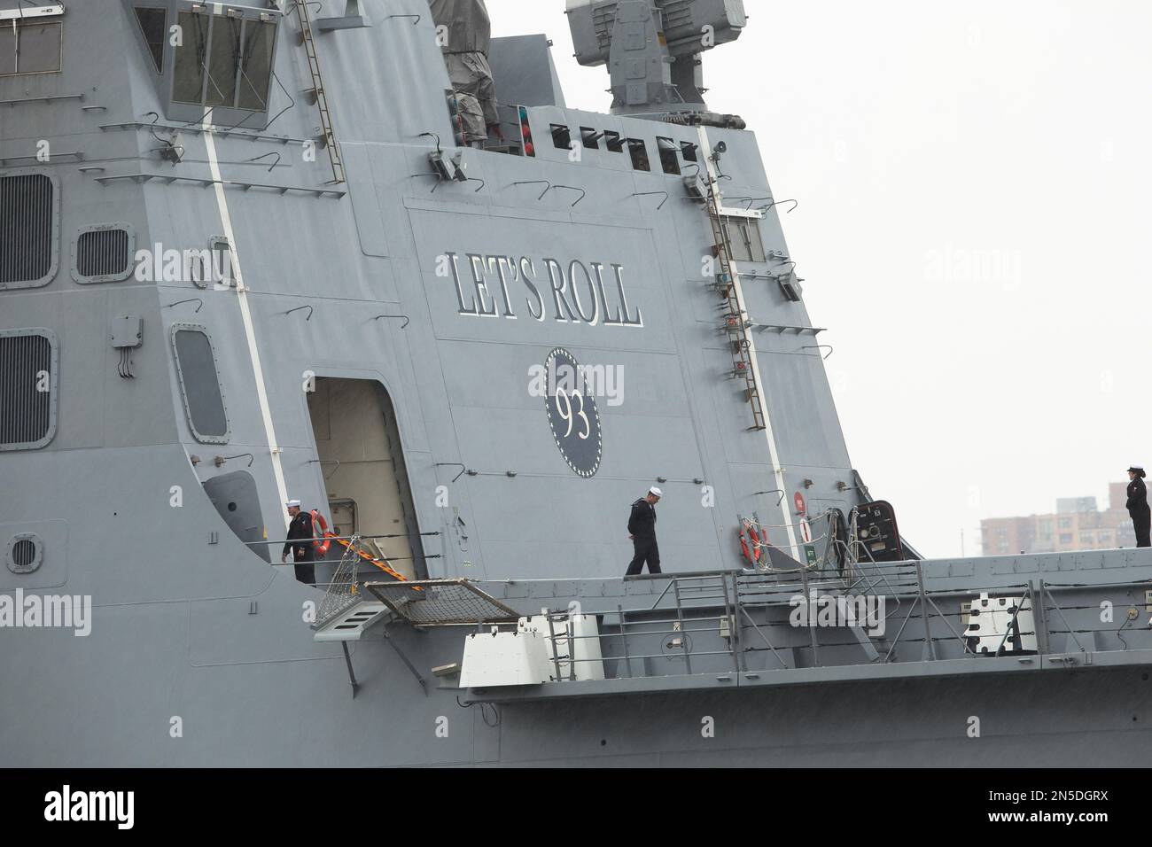 A sailor walks on the deck of the USS Somerset as it arrives at Penn's ...