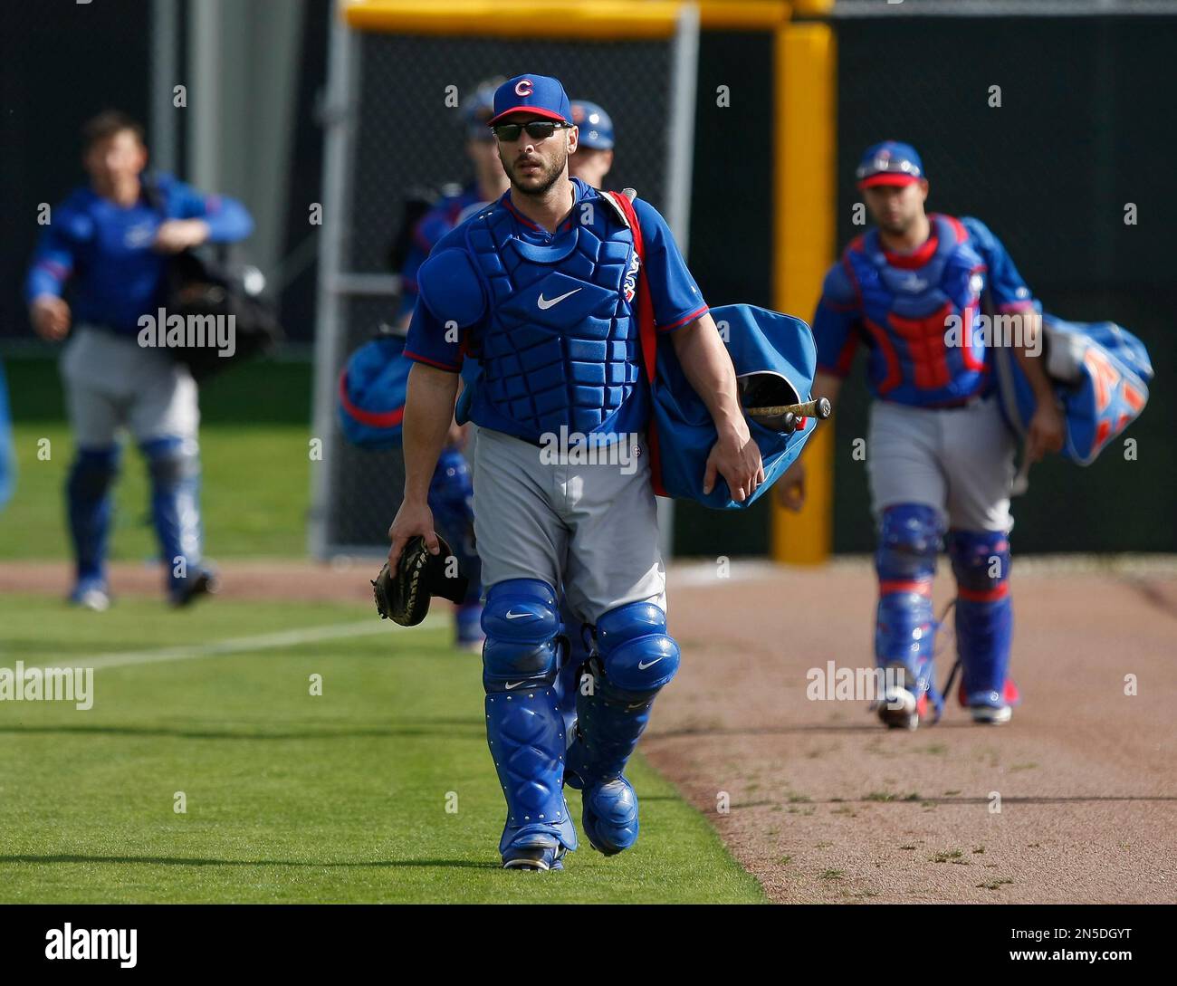 Chicago Cubs catcher George Kottaras (9) walks to drills during spring ...