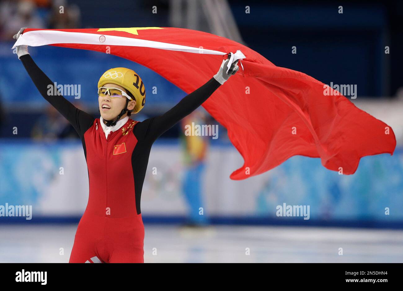Fan Kexin of China celebrates with the national flag after her second ...