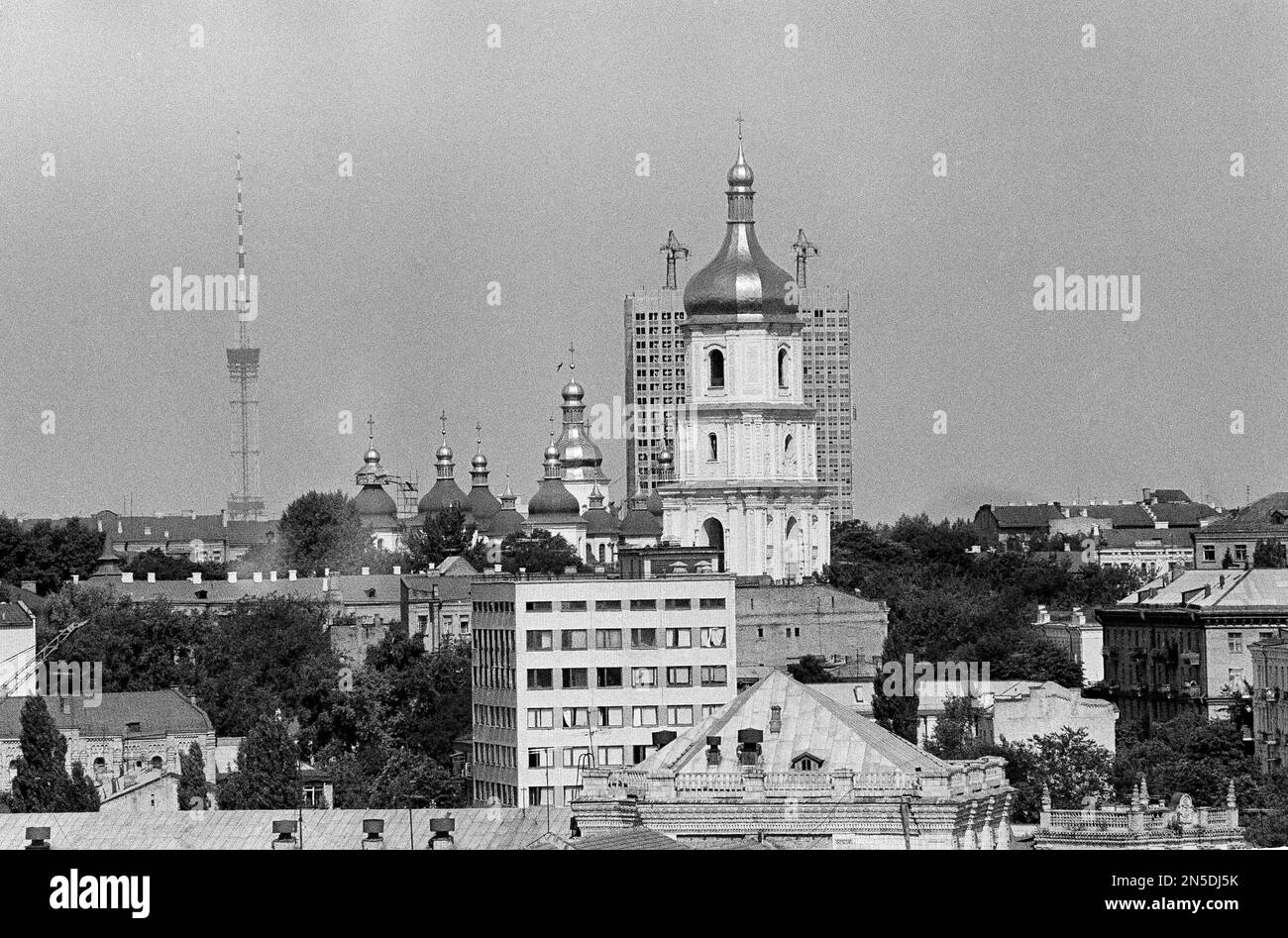 New construction surrounds historic buildings in Kiev, Ukraine, shown ...
