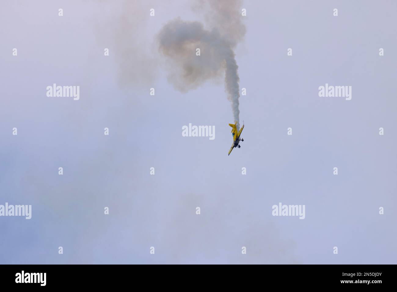 A stunt pilot performing at an air show Stock Photo - Alamy