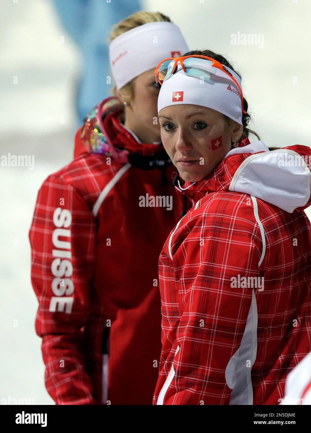 Switzerland's Selina Gasparin, right, and Elisa Gasparin walk in the ...