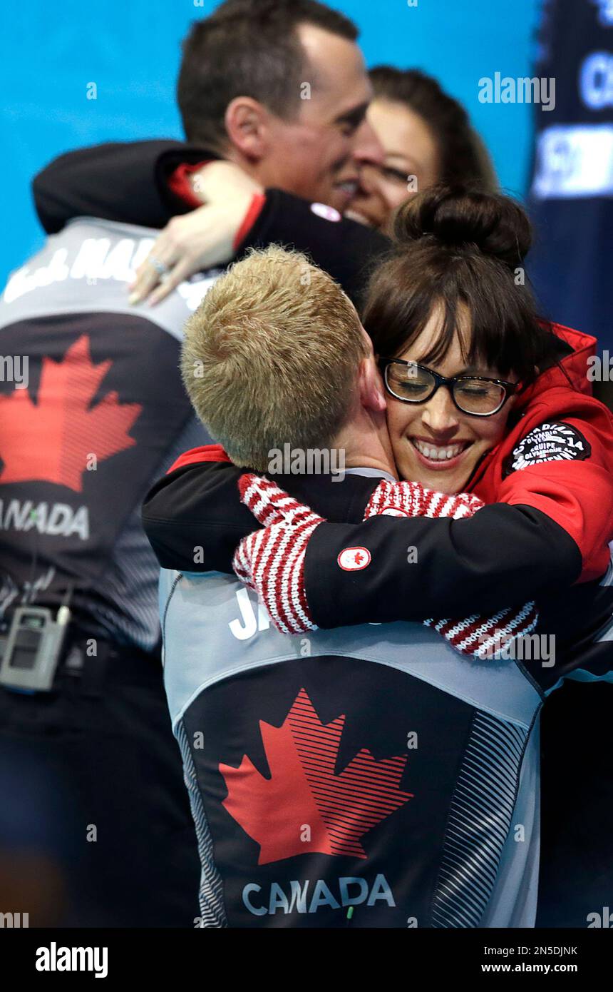Canada's skip Brad Jacobs embraces his wife Shawna, as they celebrate ...