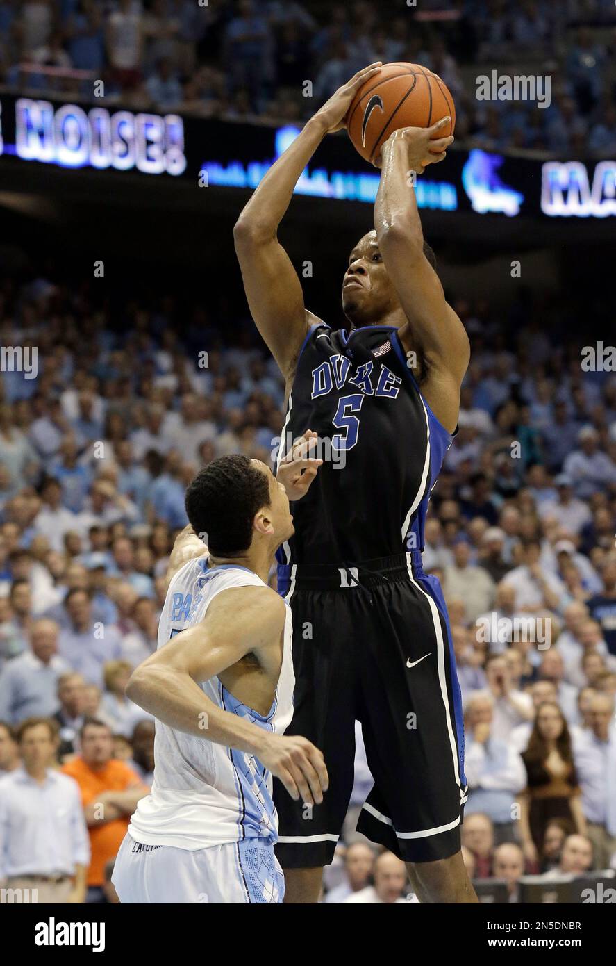 Duke's Rodney Hood (5) shoots as North Carolina's Marcus Paige defends ...