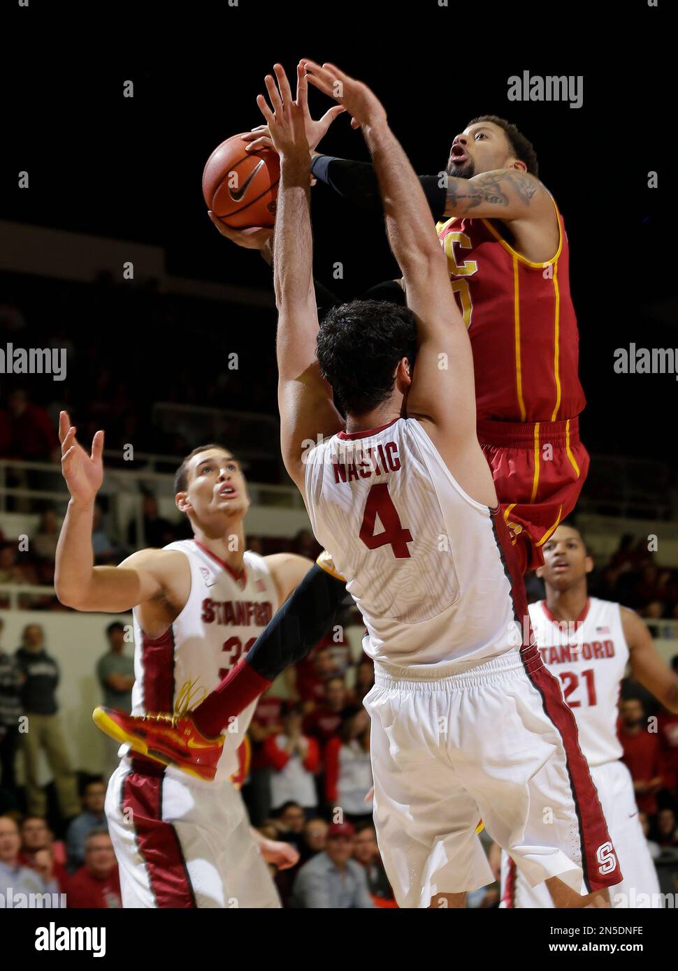 Southern California guard J.T. Terrell, top, shoots over Stanford's ...