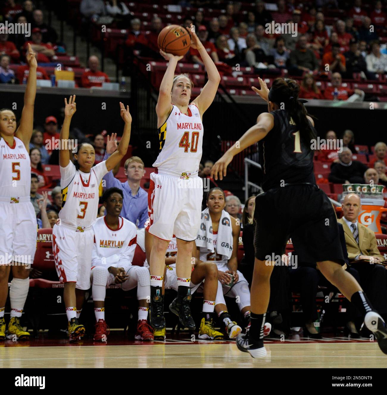 Maryland's Katie Rutan, left, shoots as Florida State's Morgan Jones ...