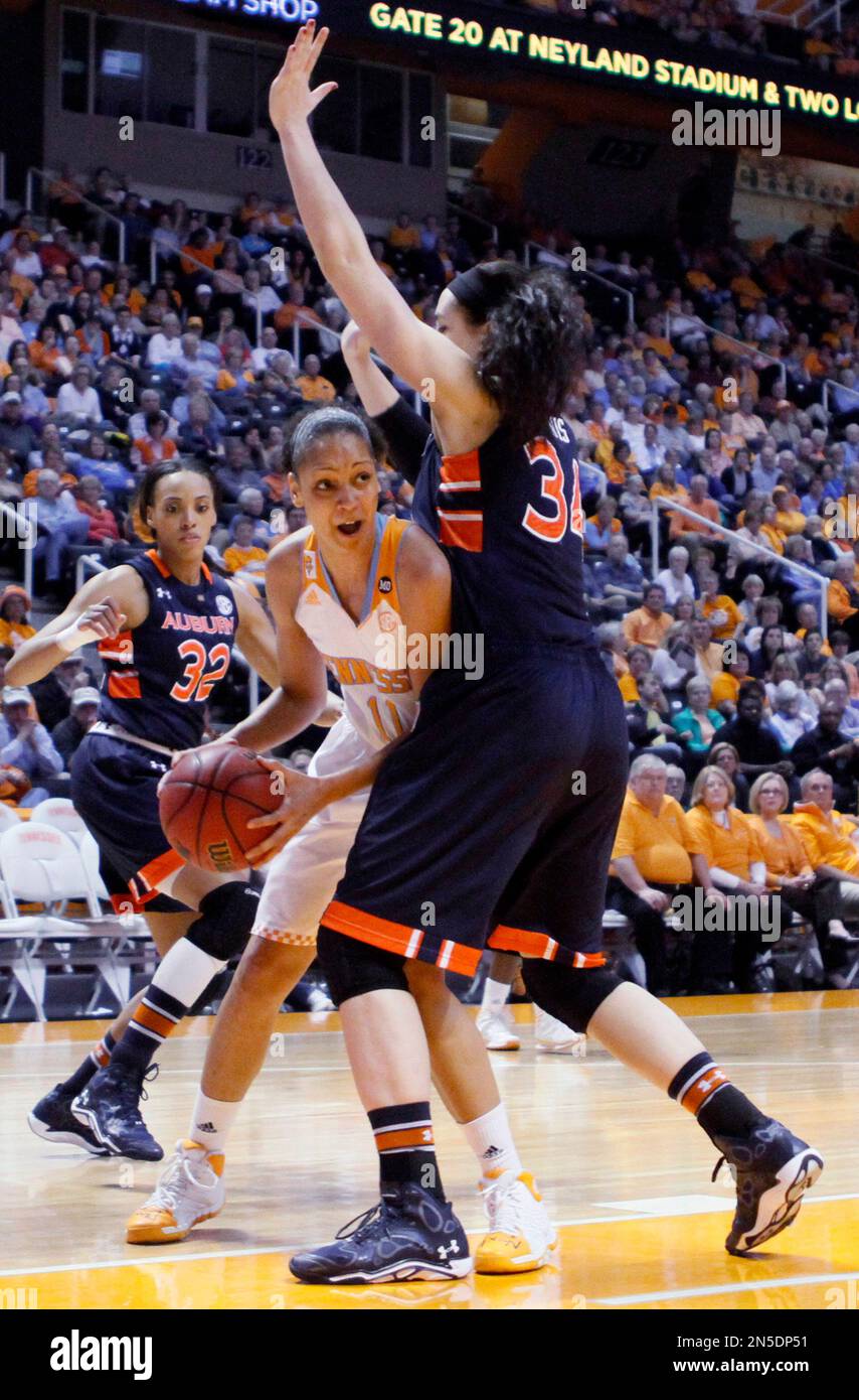 Tennessee forward Cierra Burdick (11) looks for help as she's defended ...