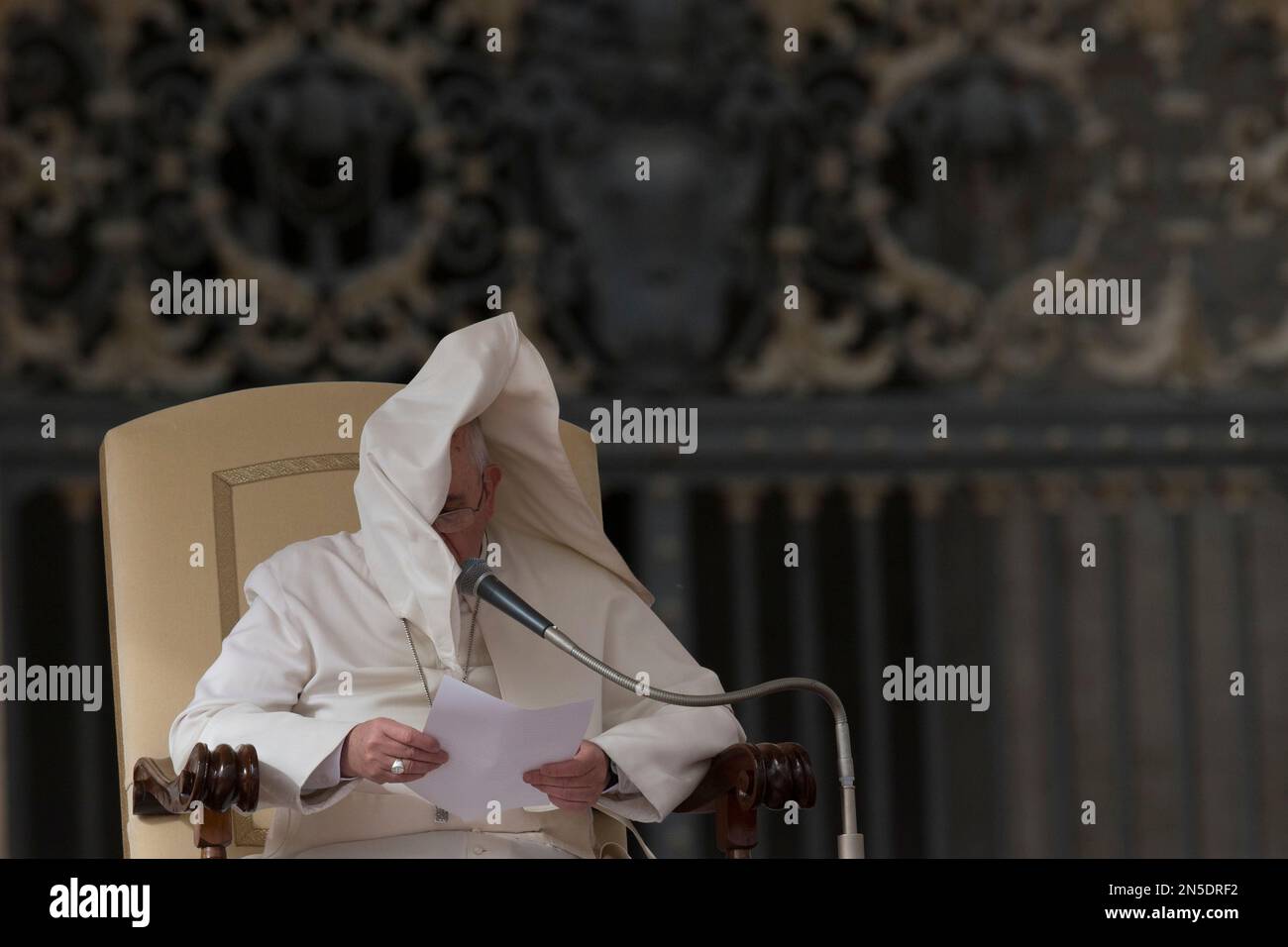 A gust of wind blows Pope Francis' cape during his weekly general ...