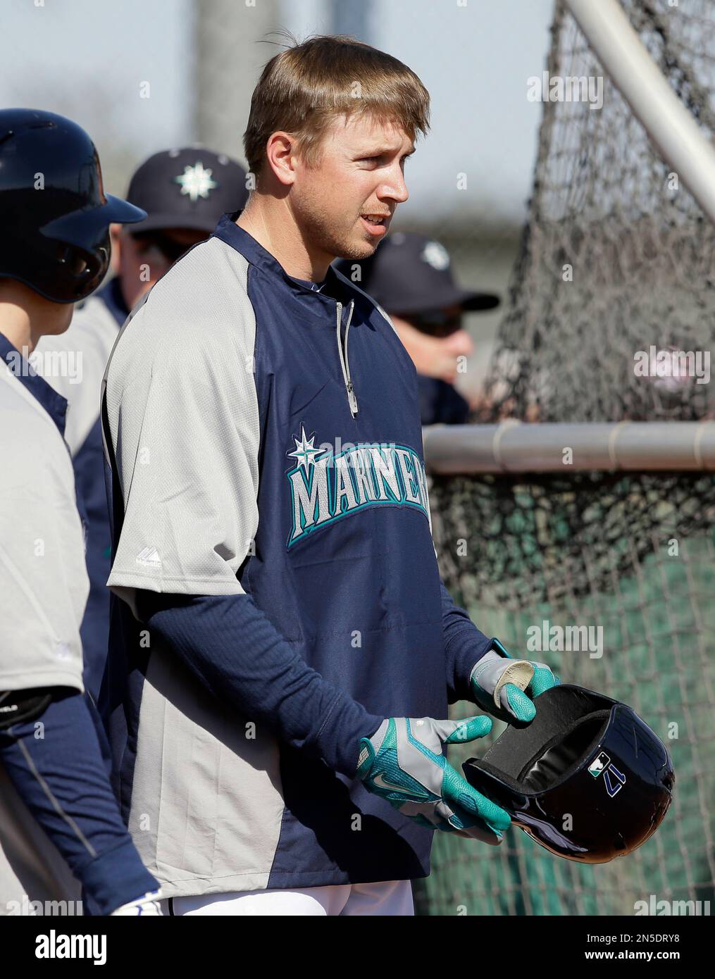 Seattle Mariners' Justin Smoak watches the flight of a ball as he waits ...