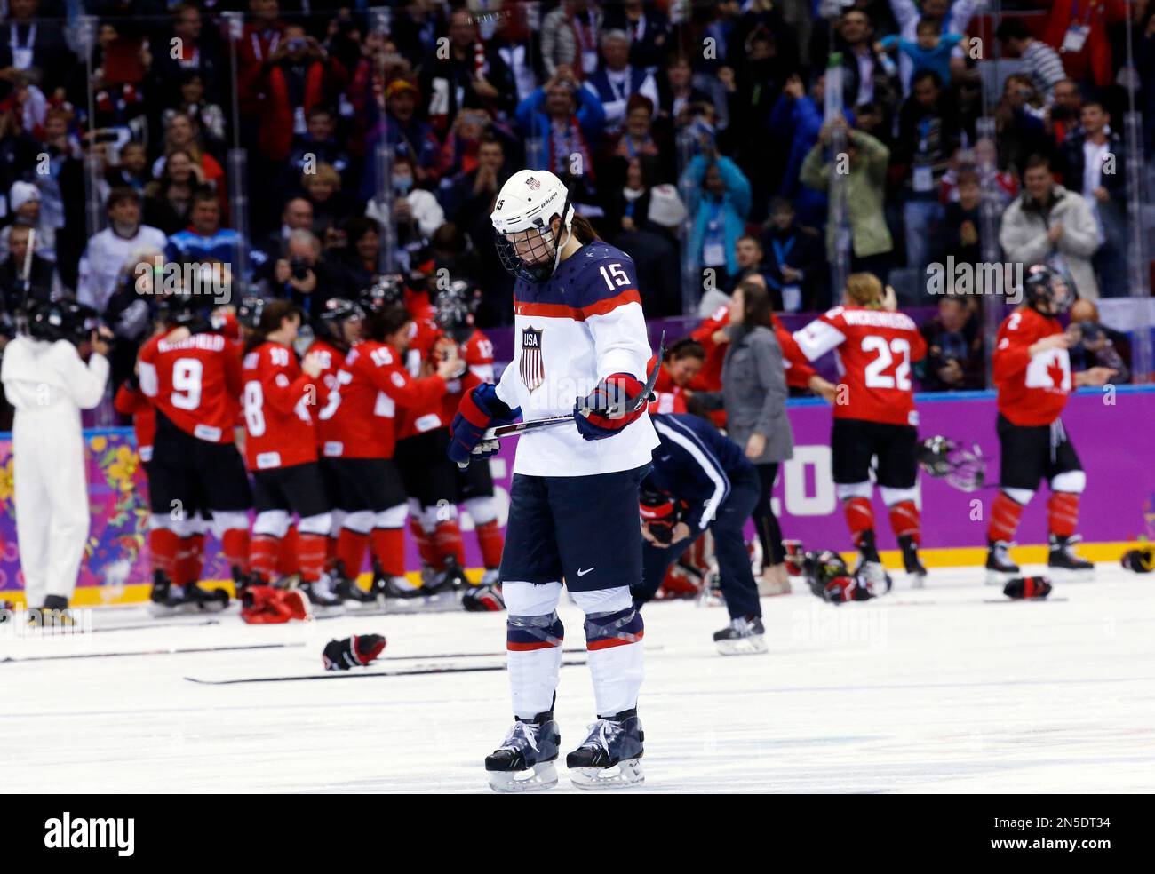 Anne Schleper of the United States (15) skates back to the bench after ...