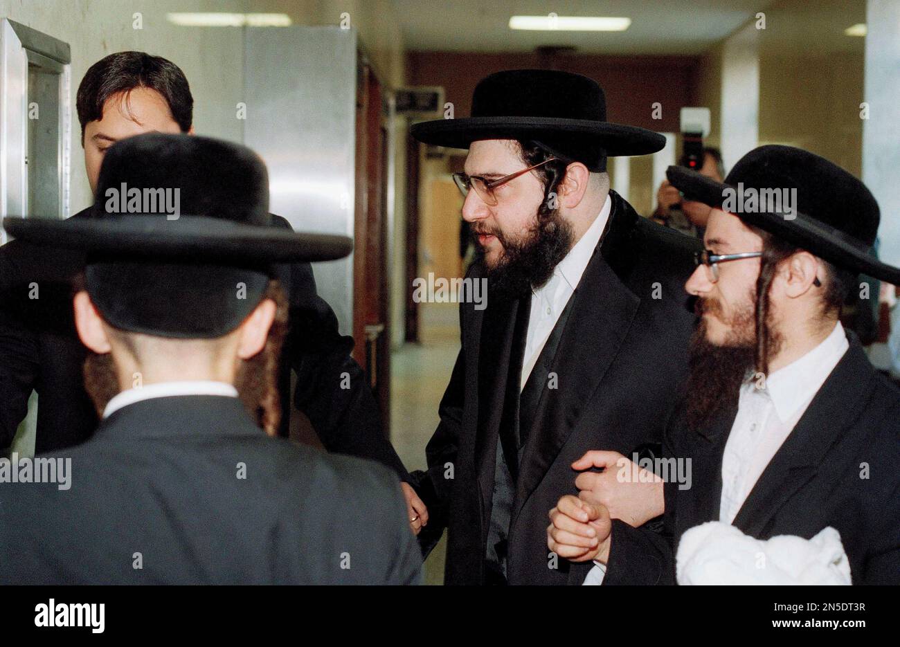 Rabbi Shlomo Hebrans, center, arrives for his trial at state Supreme ...