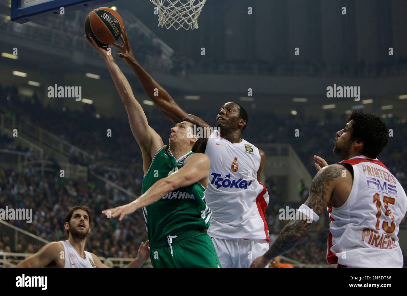 Panathinaikos' Dimitris Diamantidis, left, is stopped by Olympiakos ...