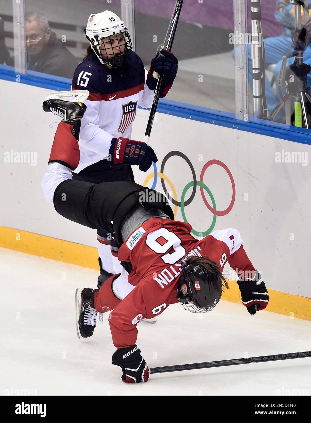 Anne Schleper of the United States, left, takes down Rebecca Johnston ...