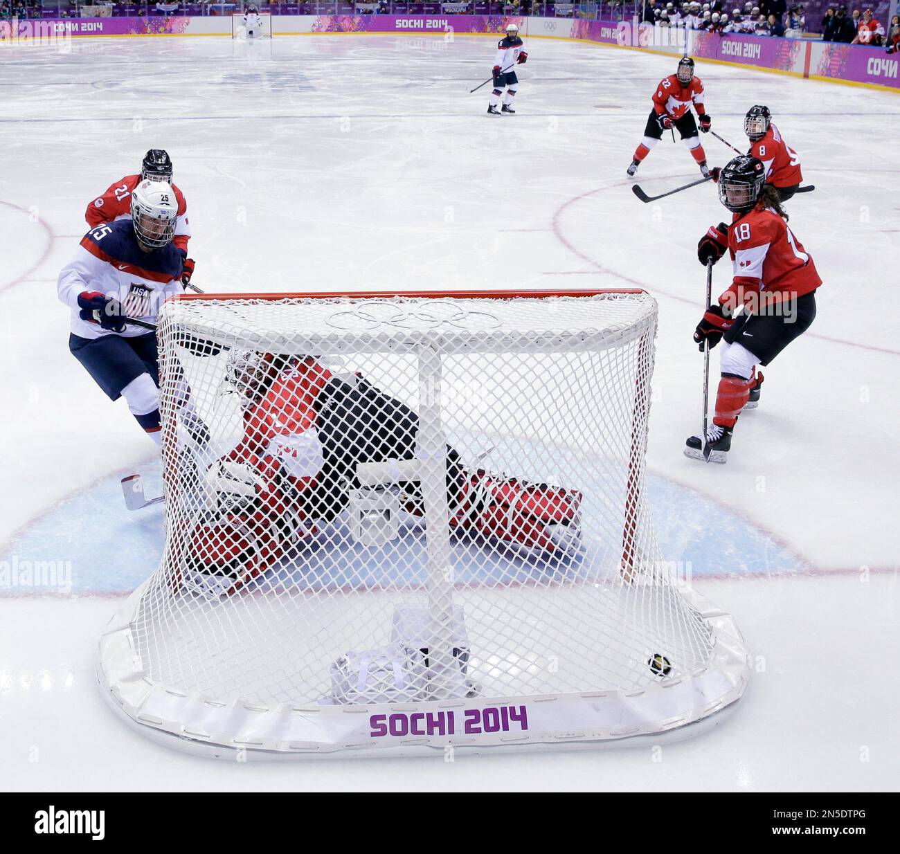 Alex Carpenter of the United States (25) scores past goalkeeper Shannon ...