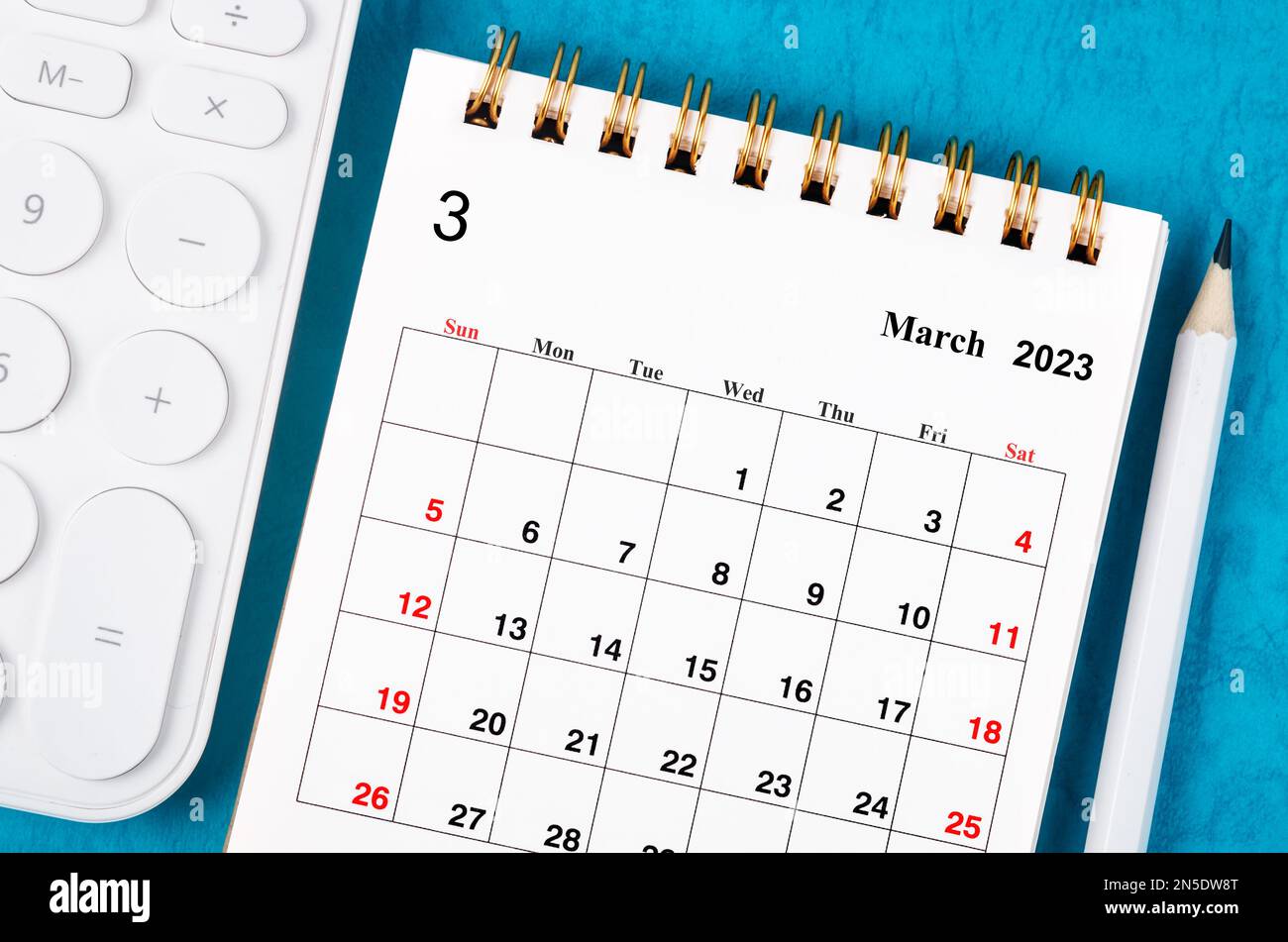 March 2023 Monthly desk calendar for 2023 year with calculator and ...