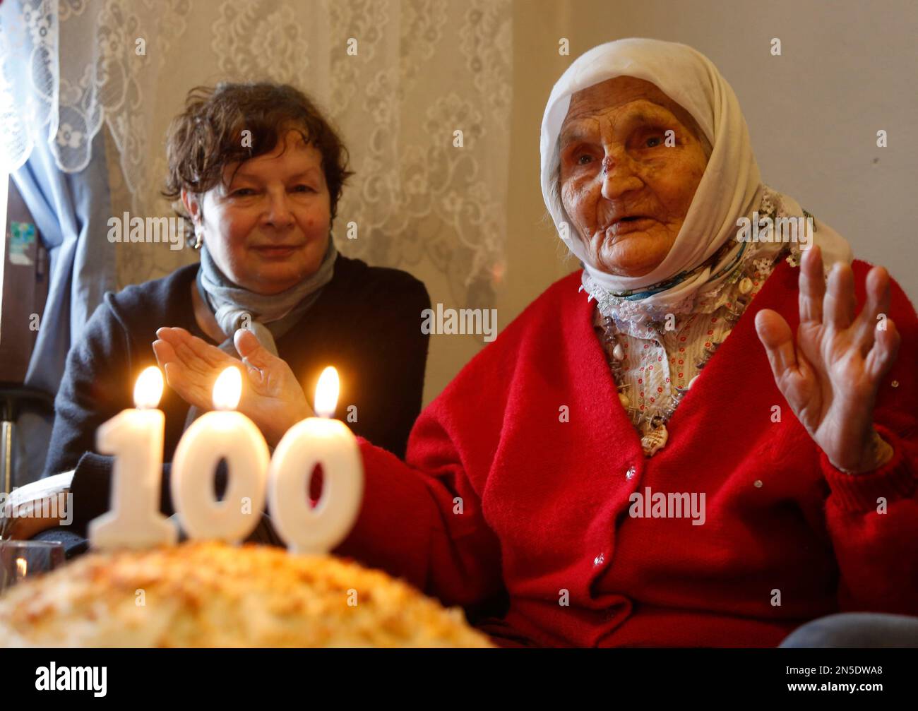 Bosnian woman Mejra Halilovic, right, gesture as she celebrate her ...