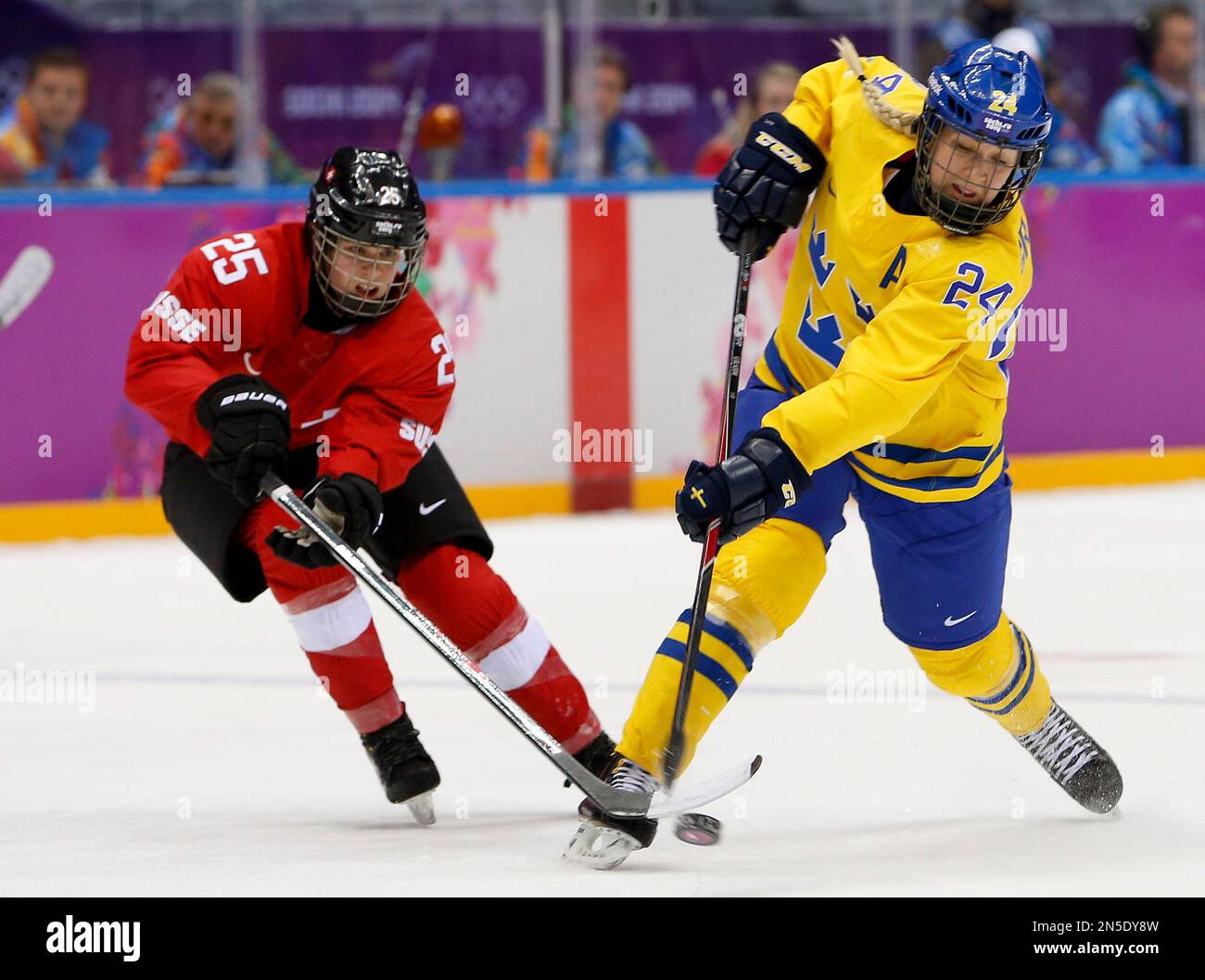 Erika Grahm of Sweden (24) takes a shot against Alina Muller of ...