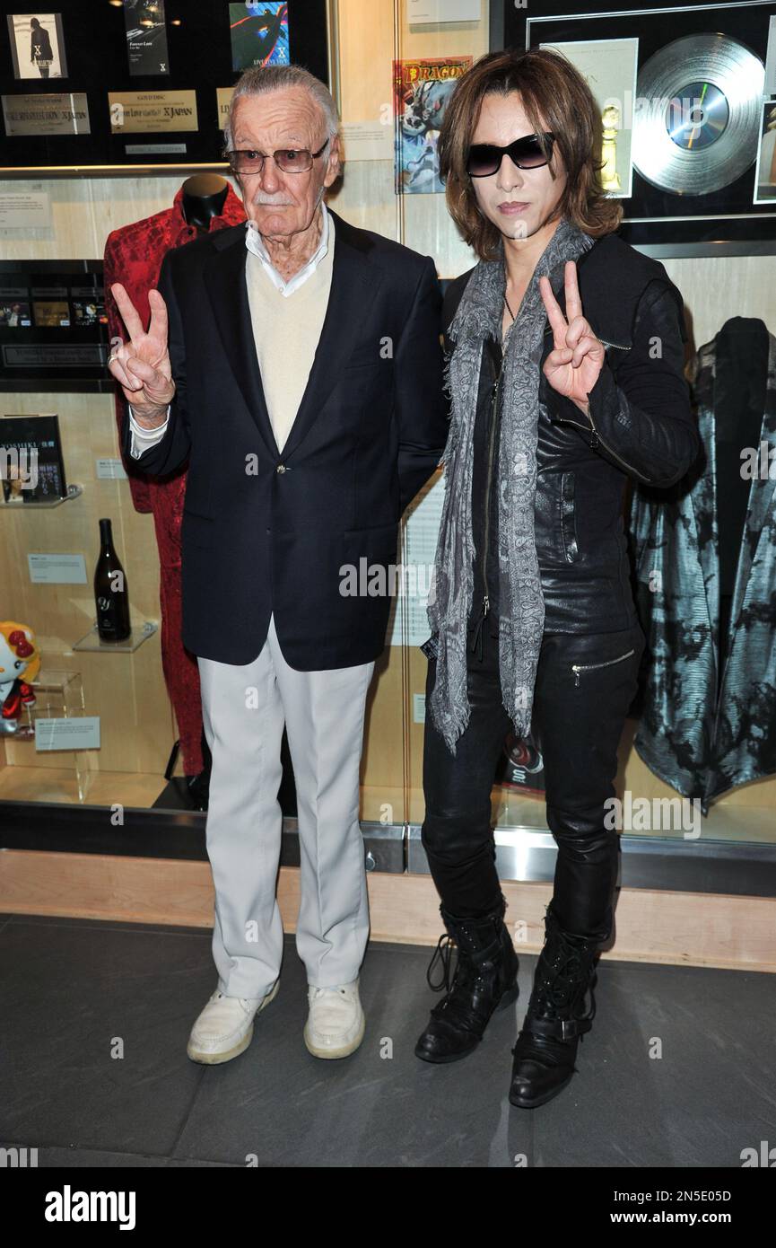 Stan Lee, left, and Yoshiki attend the GRAMMY Museum Yoshiki Exhibition ...