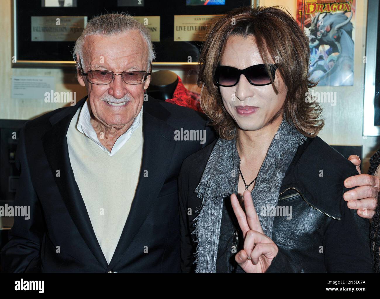 Stan Lee, left, and Yoshiki attend the GRAMMY Museum Yoshiki Exhibition ...