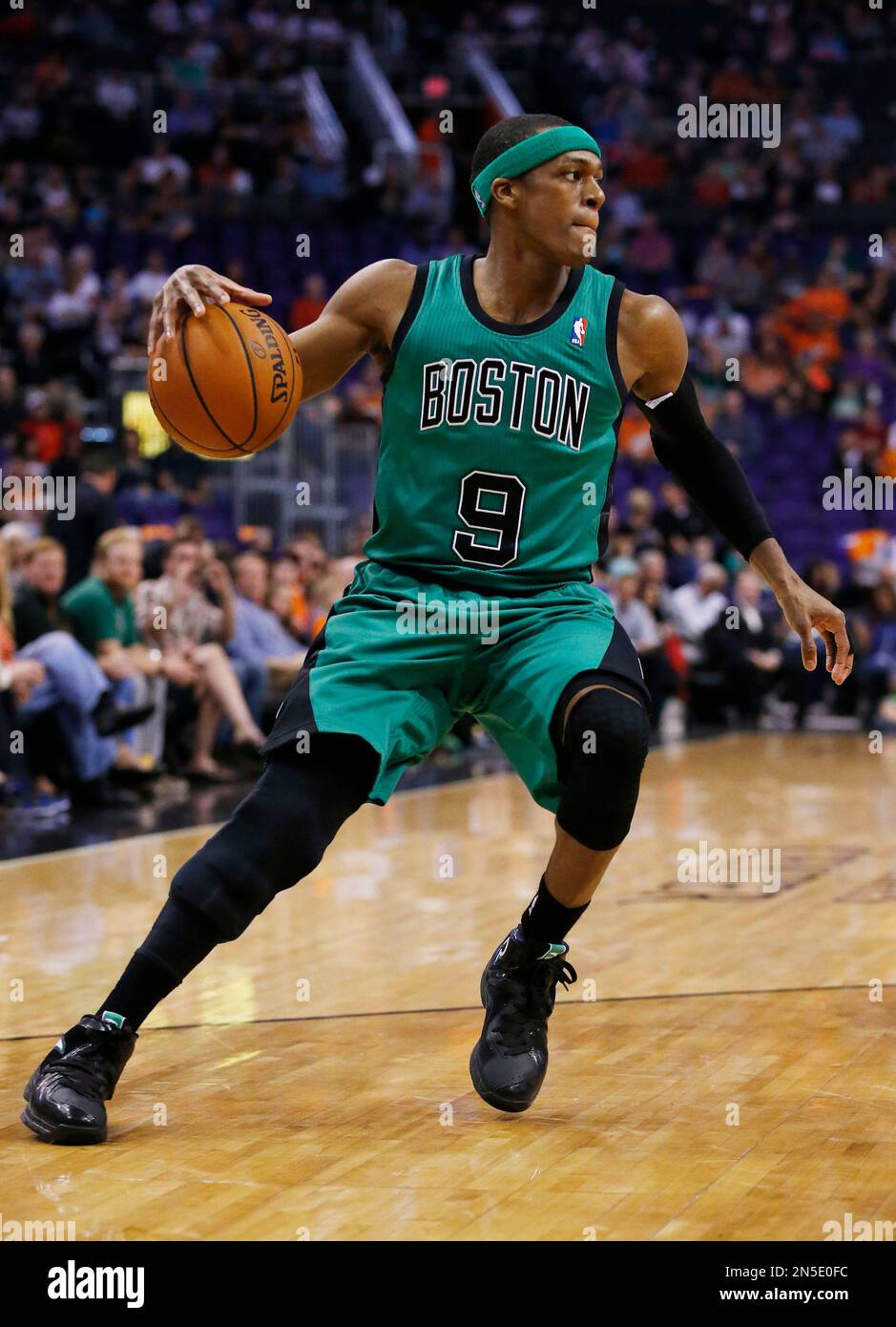 Boston Celtics' Rajon Rondo dribbles the ball against the Phoenix Suns ...