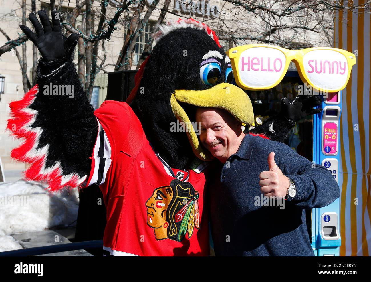 Chicago Blackhawks mascot "Tommy Hawk" swallows the head of Ron Hosman ...
