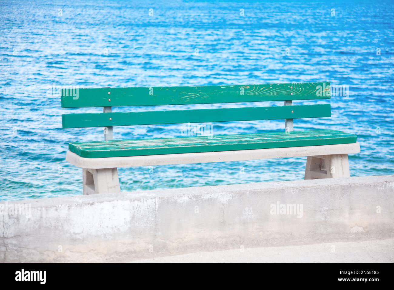Wooden bench on the seaside . Seat on the sea shore Stock Photo - Alamy