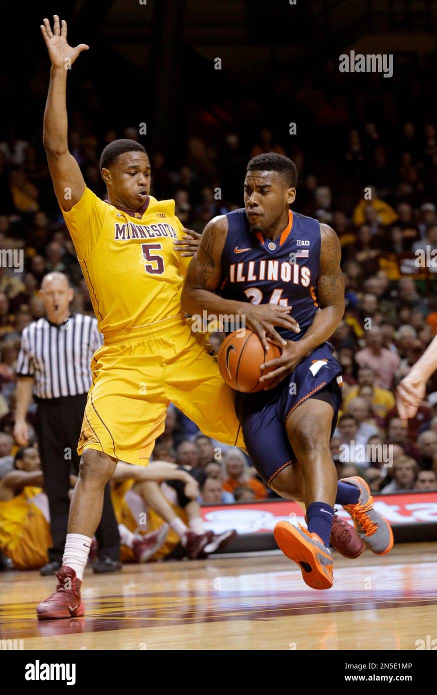 Illinois guard Rayvonte Rice, right, drives against Minnesota guard ...