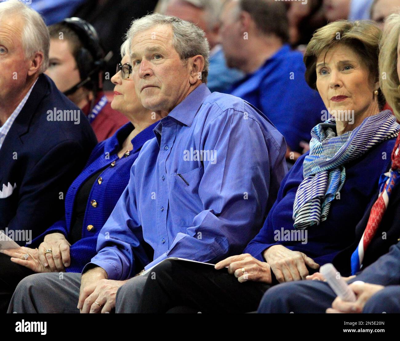 Former president George W. Bush and wife Laura Bush watch action during ...