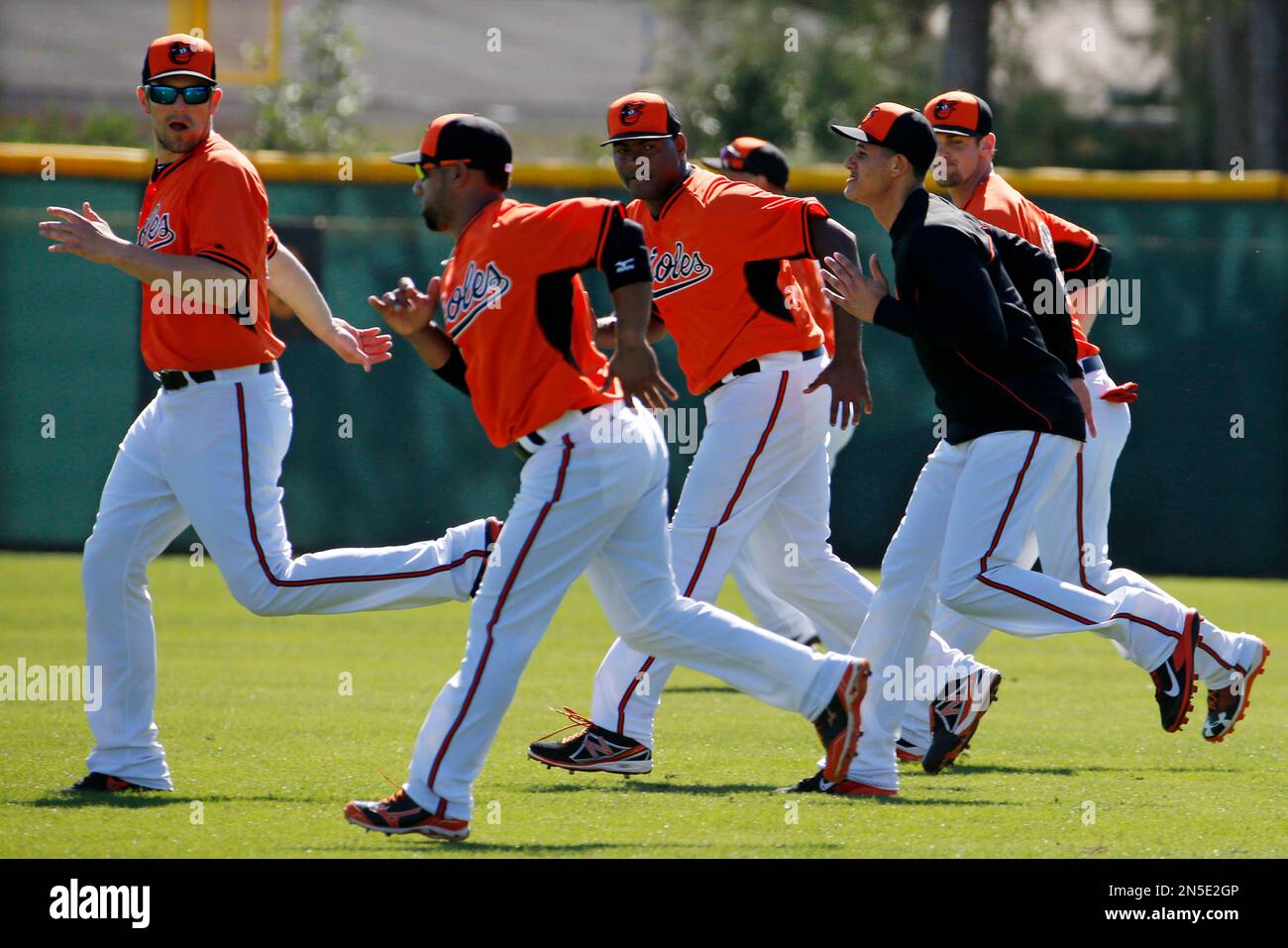 Baltimore Orioles' Manny Machado, right, warms up with teammates during ...