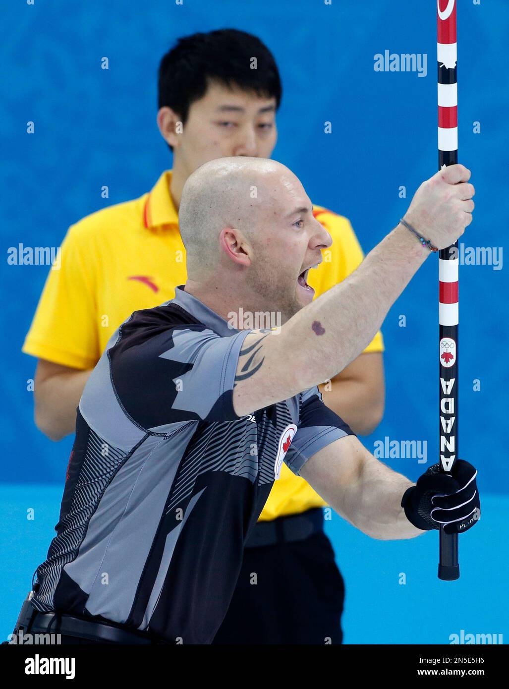 Canada’s Ryan Fry celebrates after delivering the final rock to defeat ...
