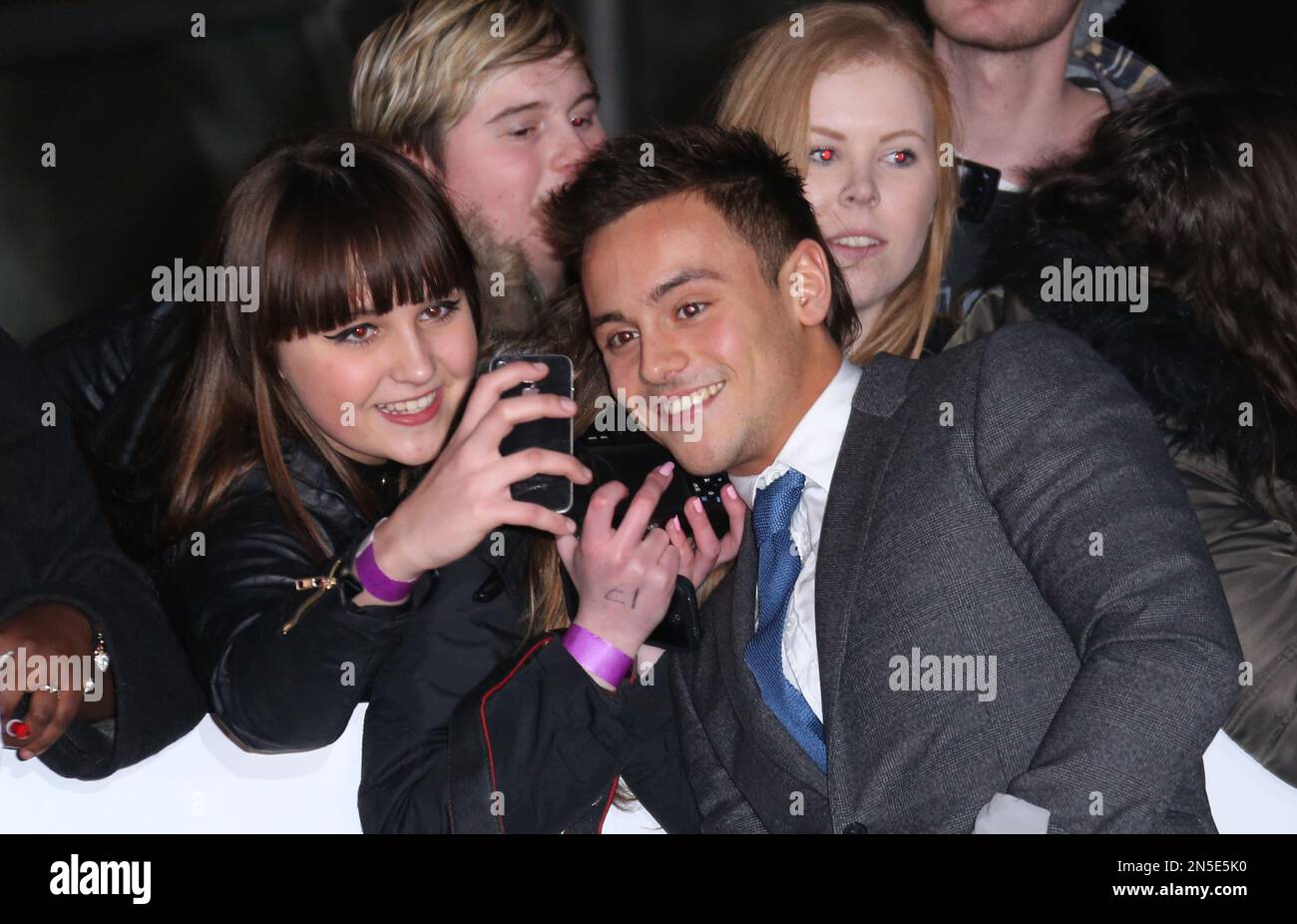 British diver Tom Daley interacts with fans upon arrival at the BRIT ...
