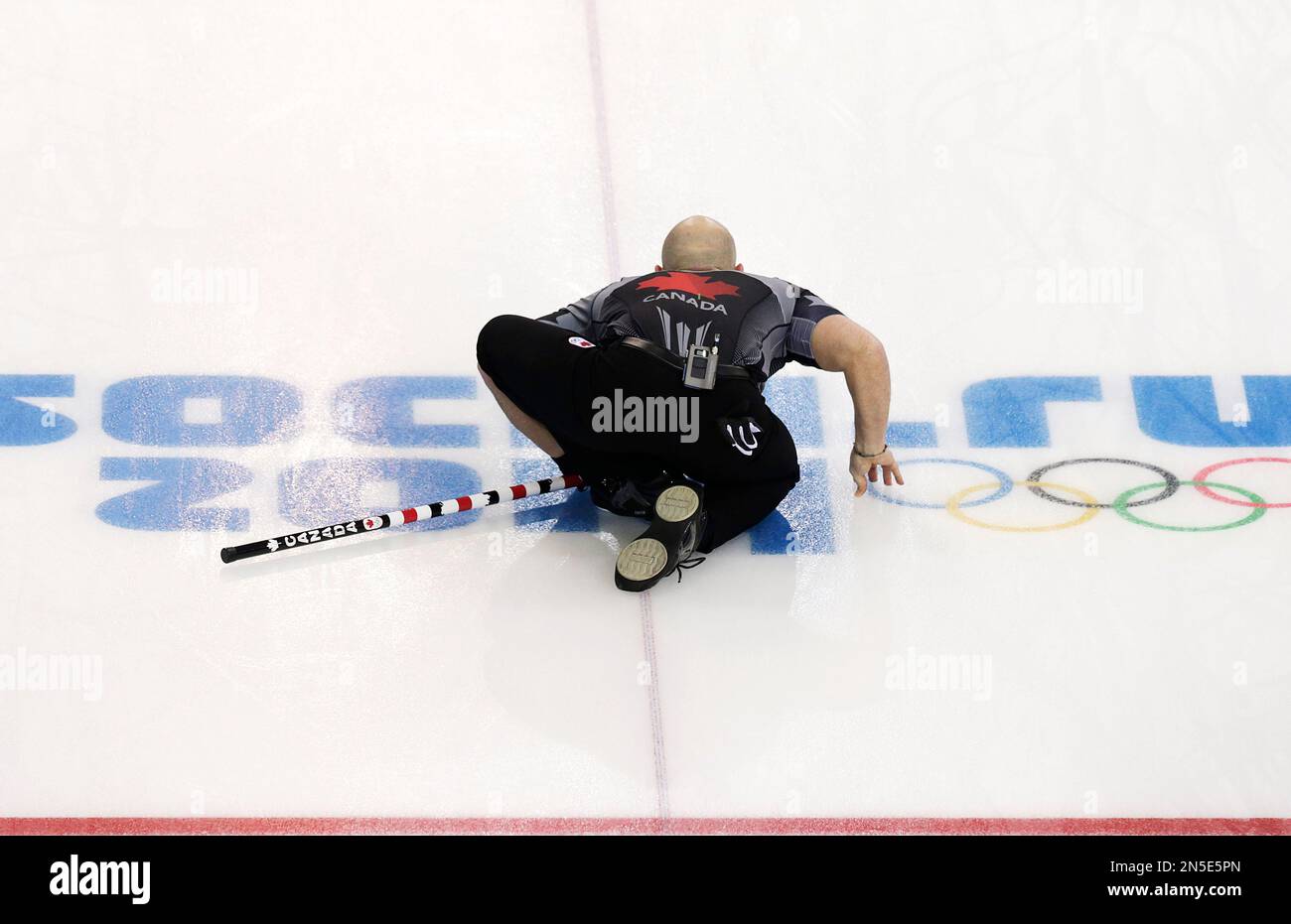 Canada's Ryan Fry watches the rock during the men's curling semifinal ...