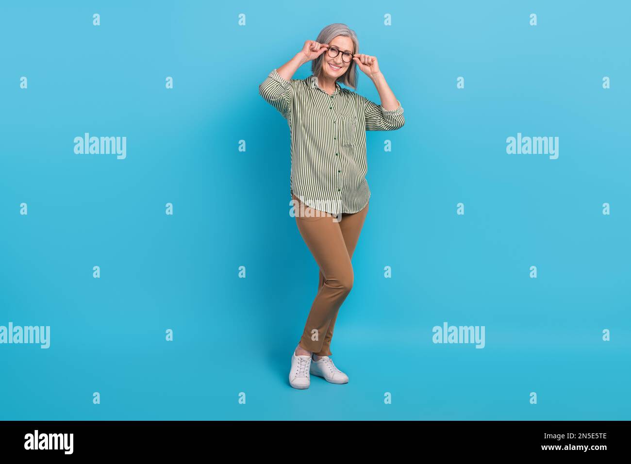 Full length photo of mature age touch eyeglasses checkup vision ...