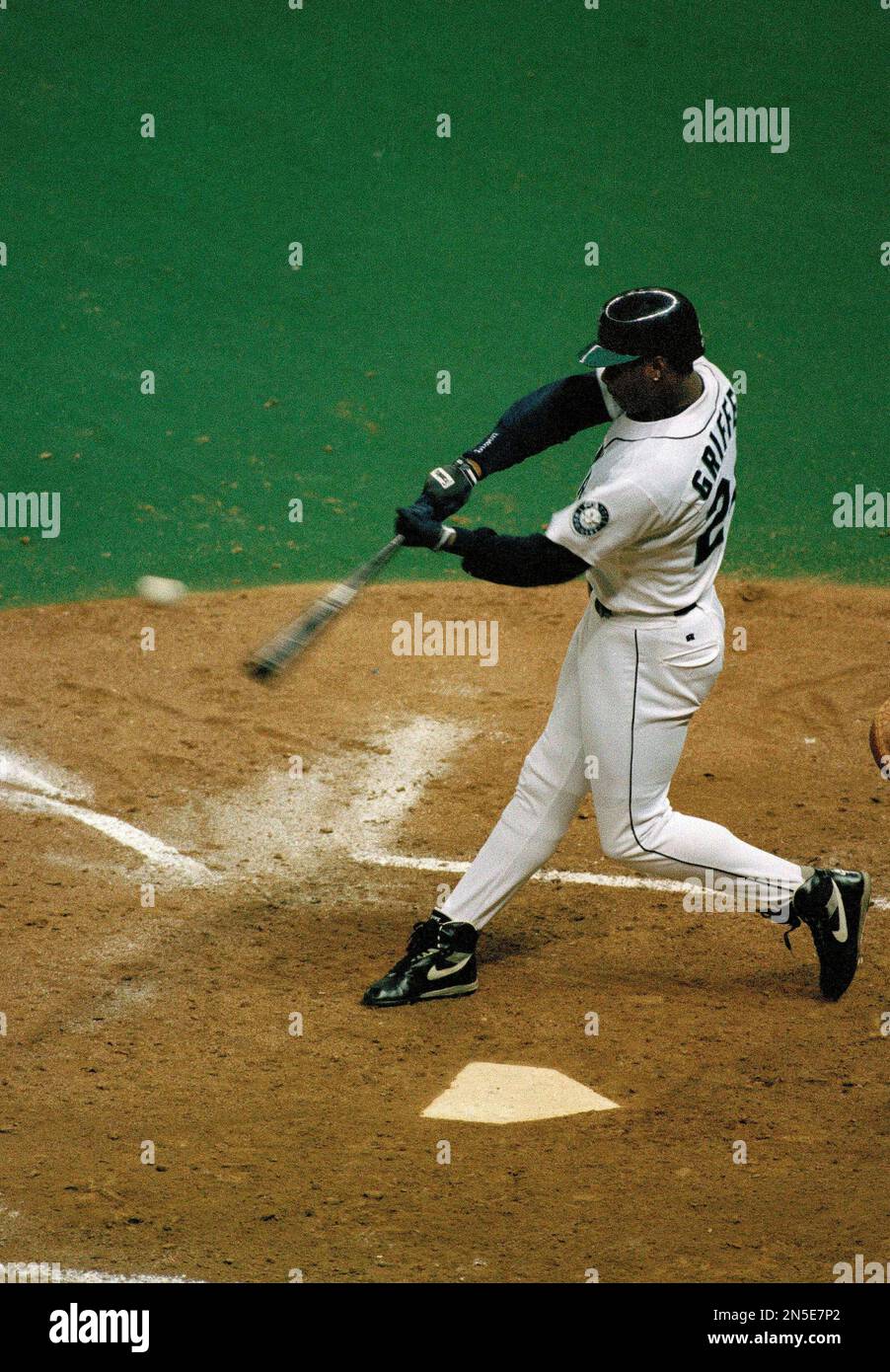 Ken Griffey Jr. of the Seattle Mariners drops his bat after belting a ...