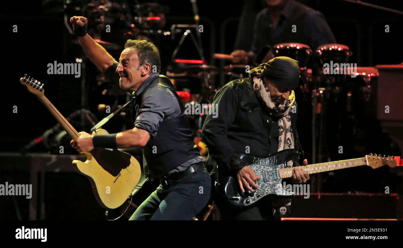 Bruce Springsteen, left, performs with the E Street Band on stage in ...