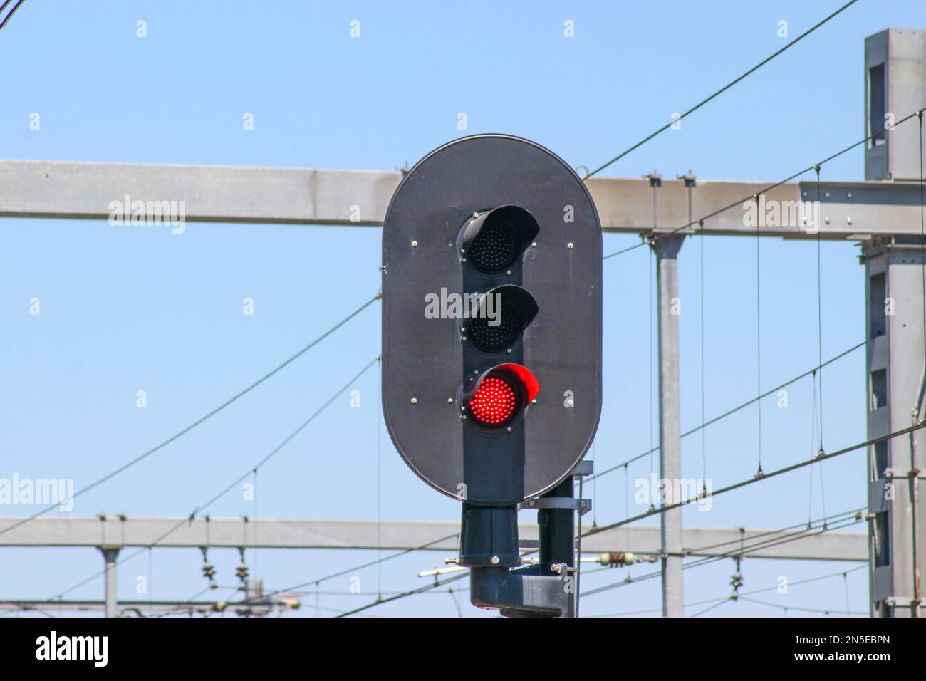 Red sign above railroad track for stopping trains in the Netherlands ...