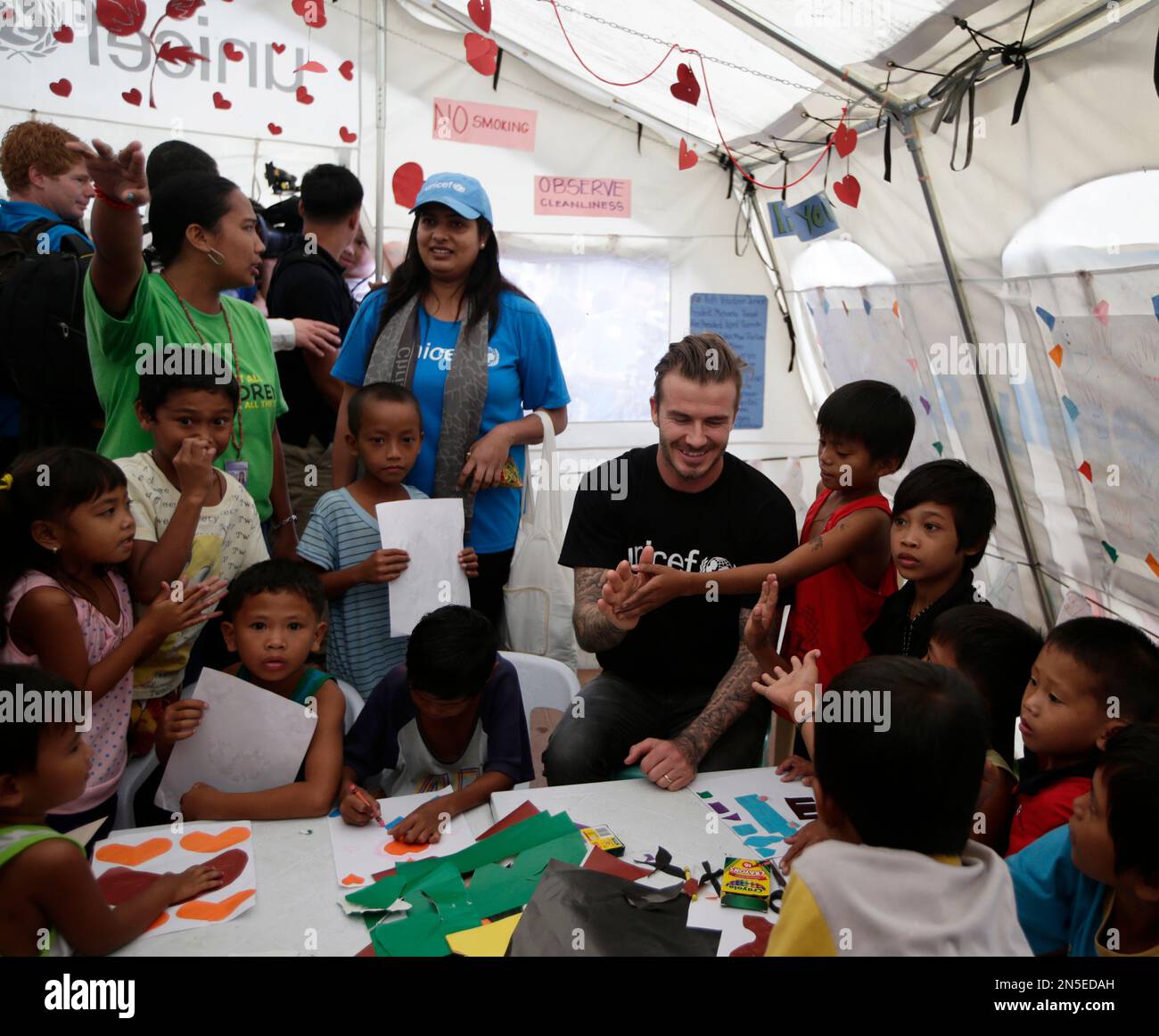 Former England soccer team captain David Beckham interacts with typhoon ...