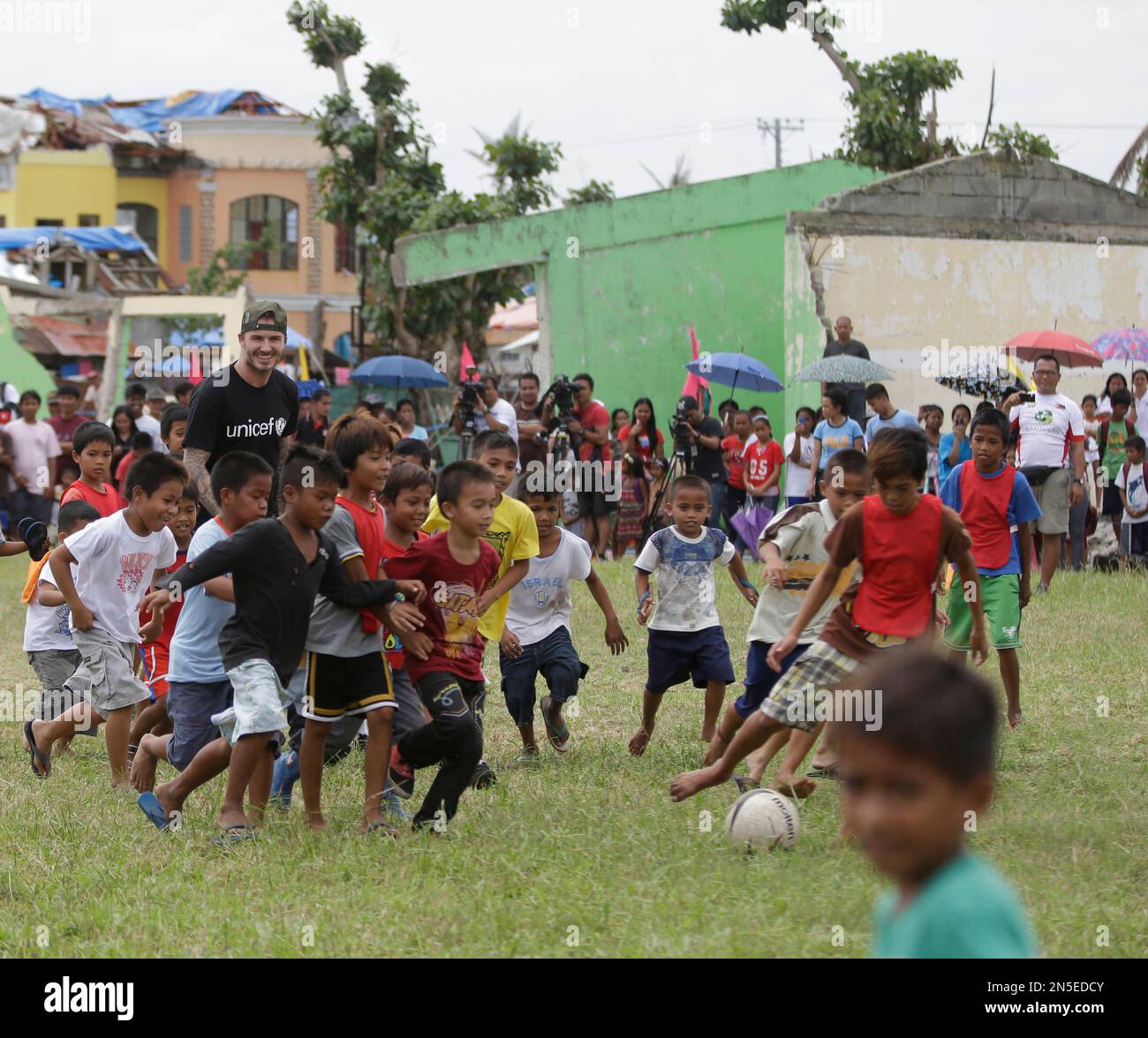 Former England soccer team captain David Beckham plays soccer with ...