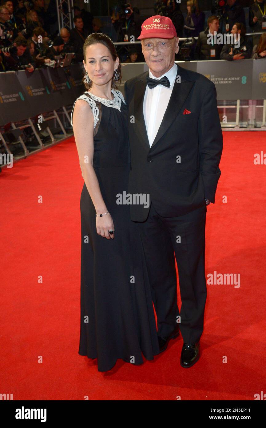 Birgit Wetzinger and Niki Lauda pose for photographers on the red ...