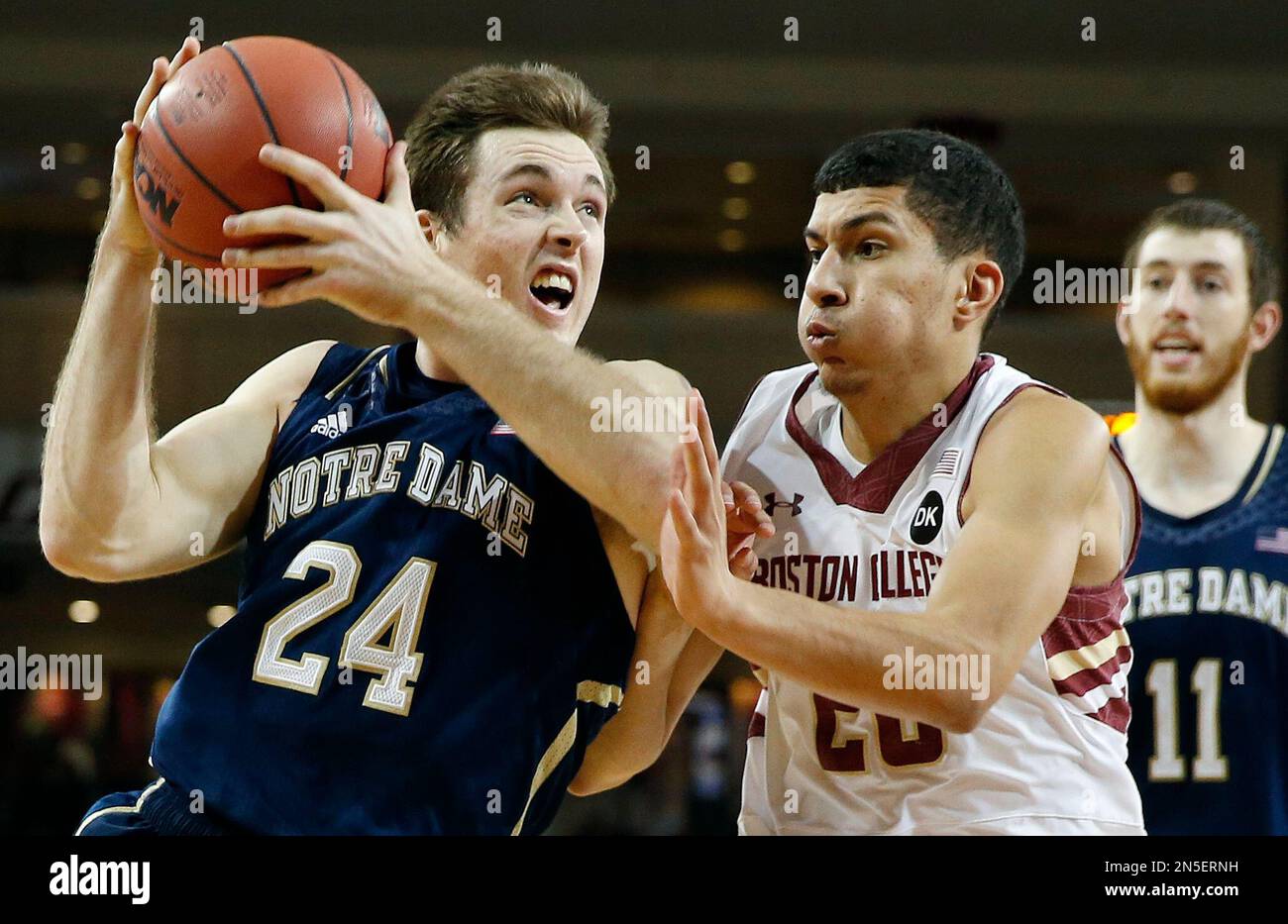 Notre Dame's Pat Connaughton (24) drives past Boston College's Lonnie Jackson (20) in the second ...