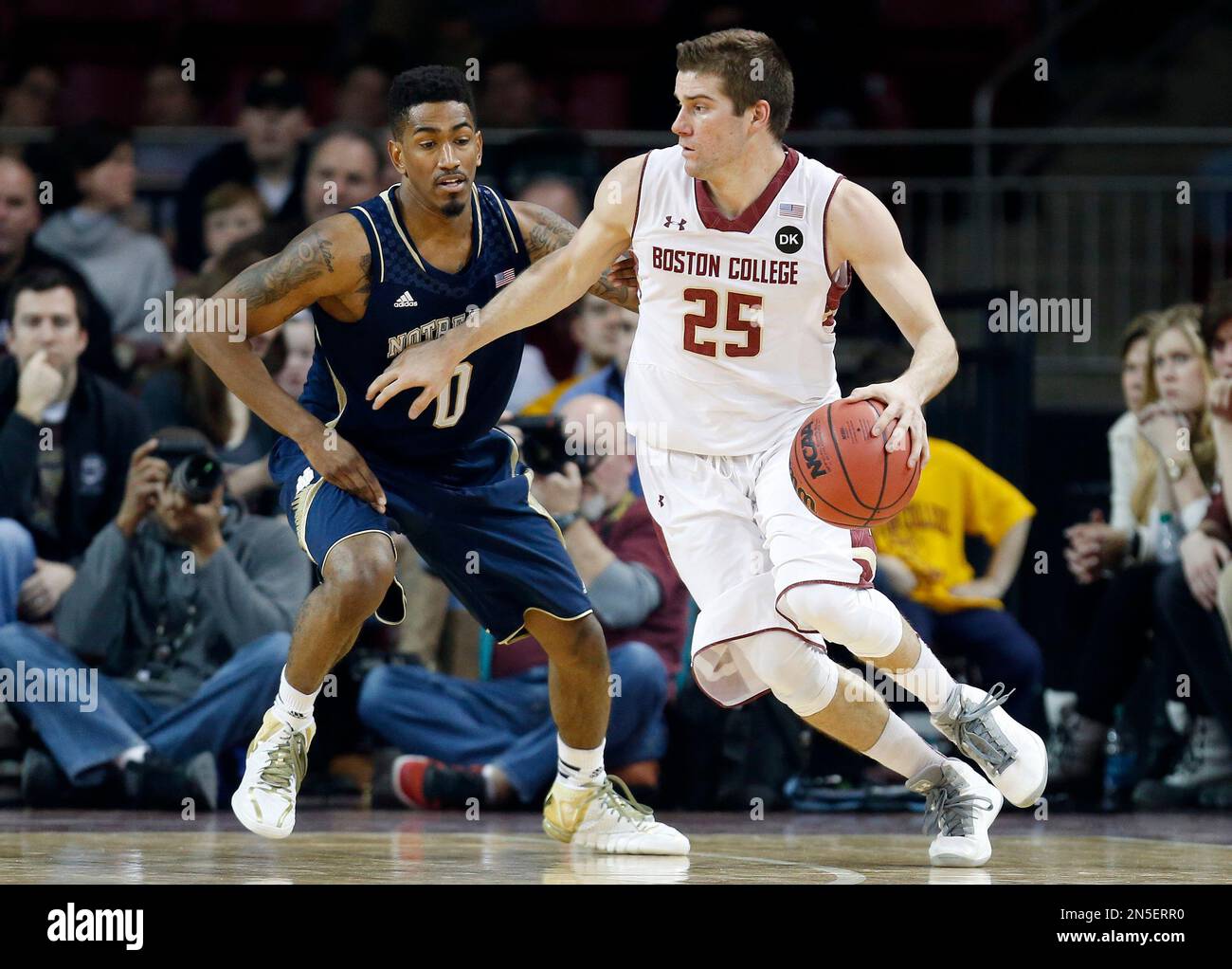 Boston College's Joe Rahon (25) drives past Notre Dame's Eric Atkins (0 ...