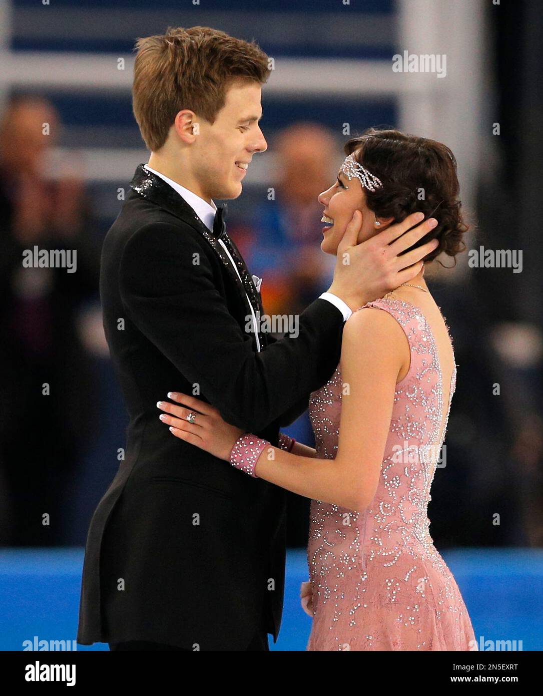 Elena Ilinykh and Nikita Katsalapov of Russia embrace after competing ...